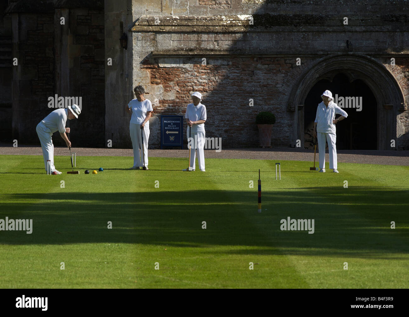 People playing croquet at the Bishop's Palace & Gardens in the City of ...