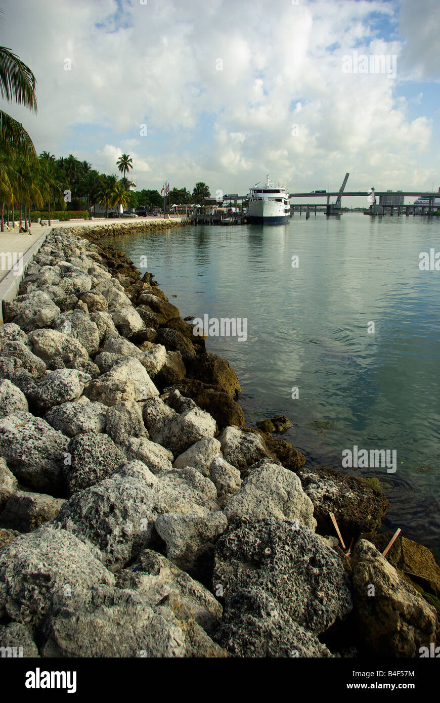 Rocks are built up on the shore of the Atlantic Ocean in Miami, Florida ...