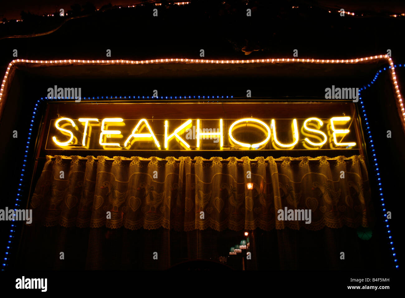 steakhouse restaurant window at night Stock Photo - Alamy