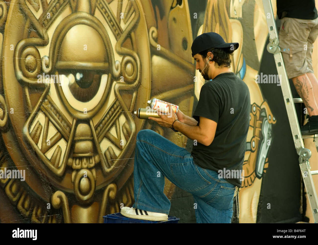 A graffiti artist steps up to his work Stock Photo - Alamy