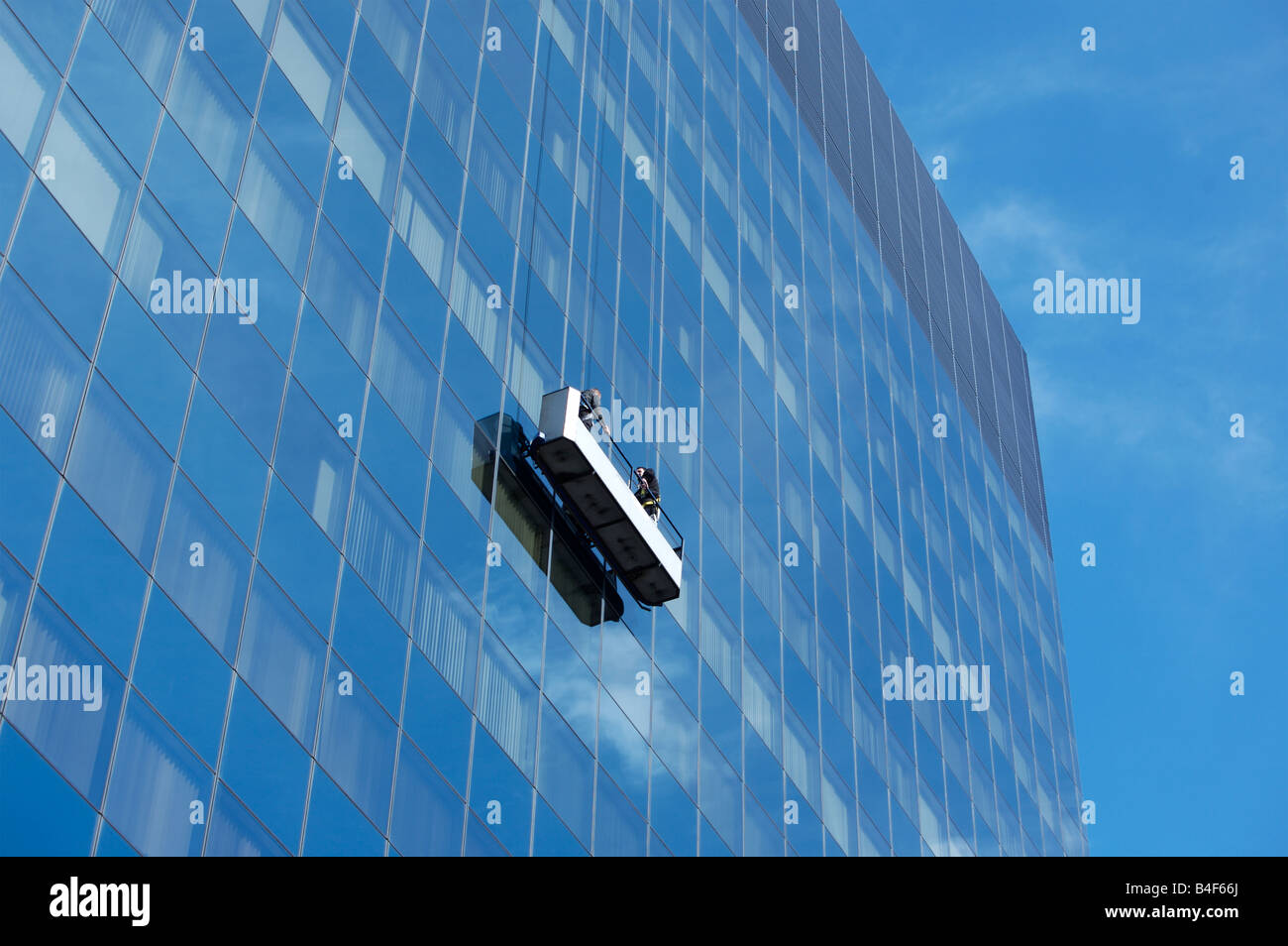 Cleaning the windows of a London city building Stock Photo - Alamy