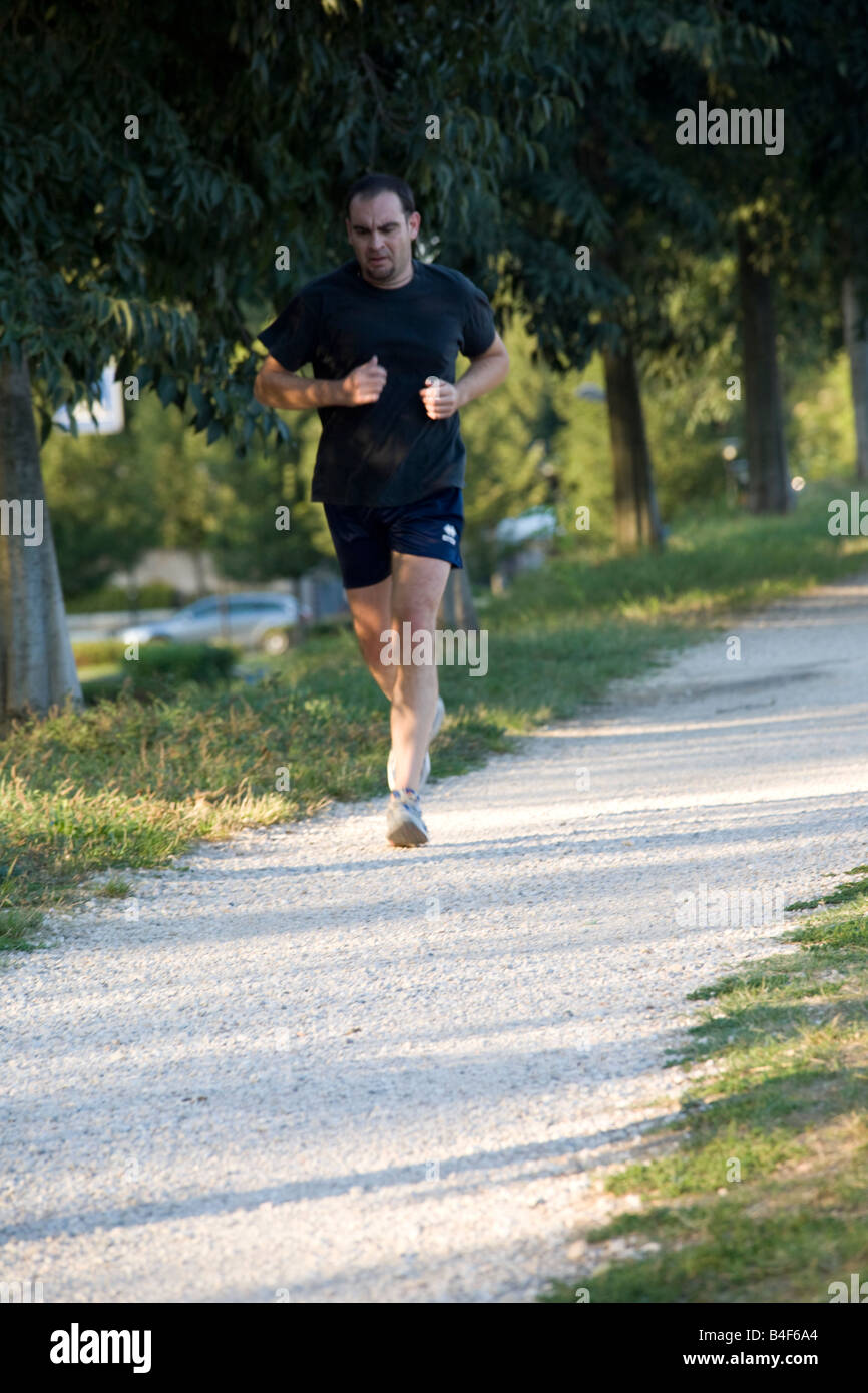 Man running on Ferrara antique city walls. Ferrara, Italy Stock Photo ...