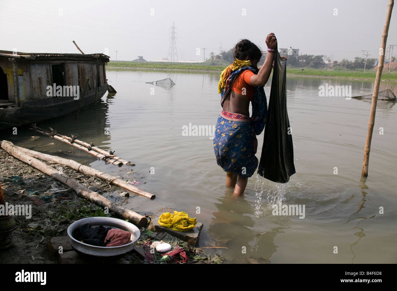 Hand washing clothes in river hi-res stock photography and images - Alamy