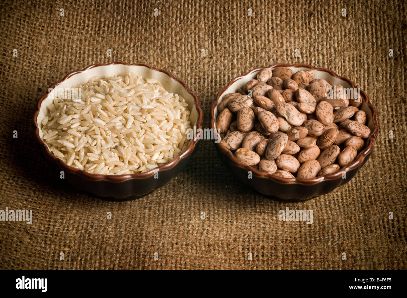 Two bowls of dried rice and beans Stock Photo - Alamy