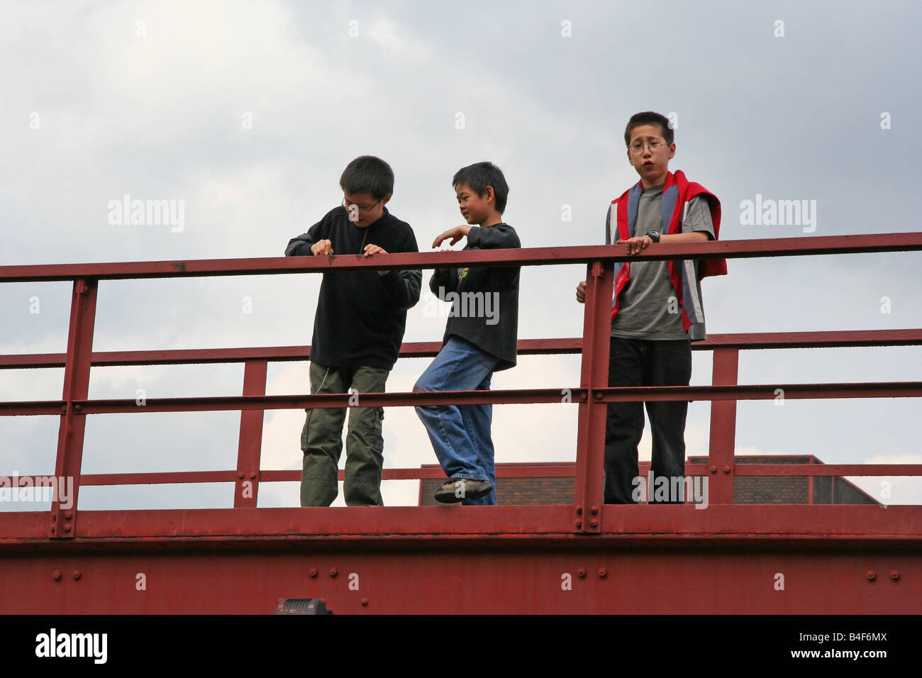 chinese boys on a bridge Stock Photo - Alamy