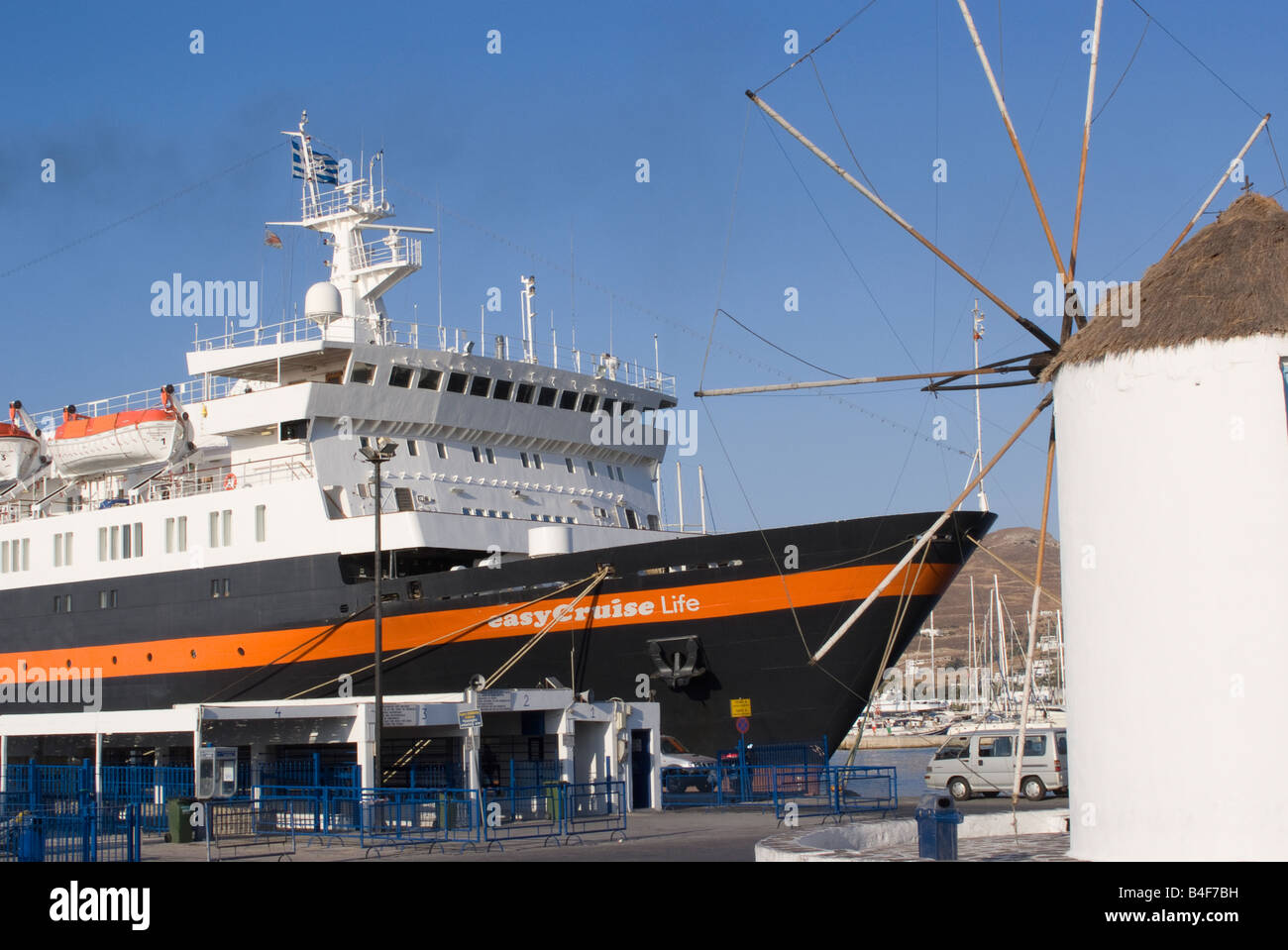 Easycruise Life Cruise Ship and Windmill Docked at Paros Town Harbour ...