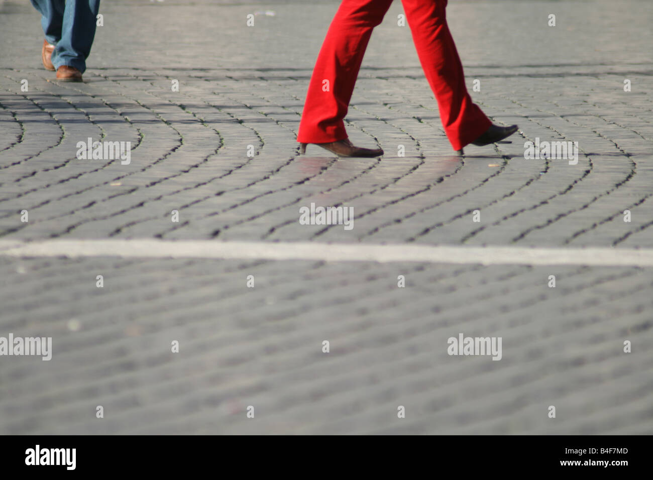 one person walking in street in city town Stock Photo - Alamy