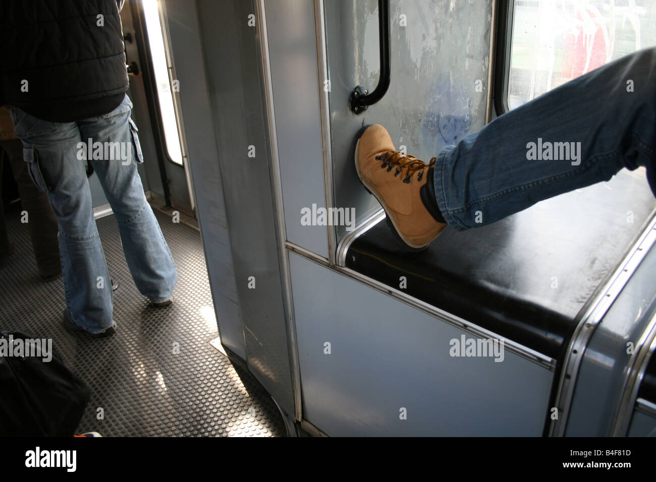 passengers legs inside tram carriage Stock Photo - Alamy