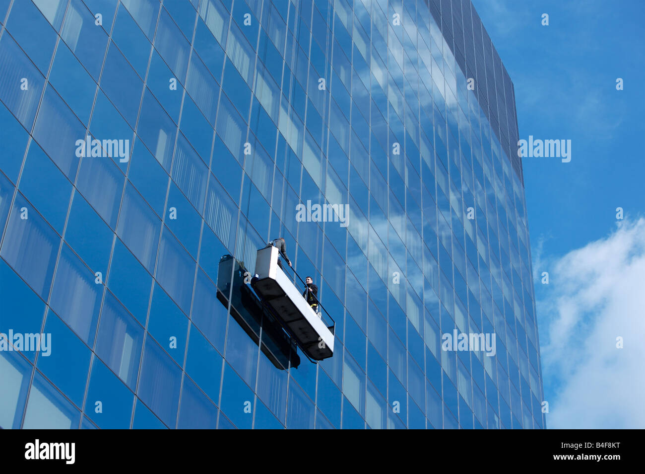 Cleaning the windows of a London city building Stock Photo - Alamy