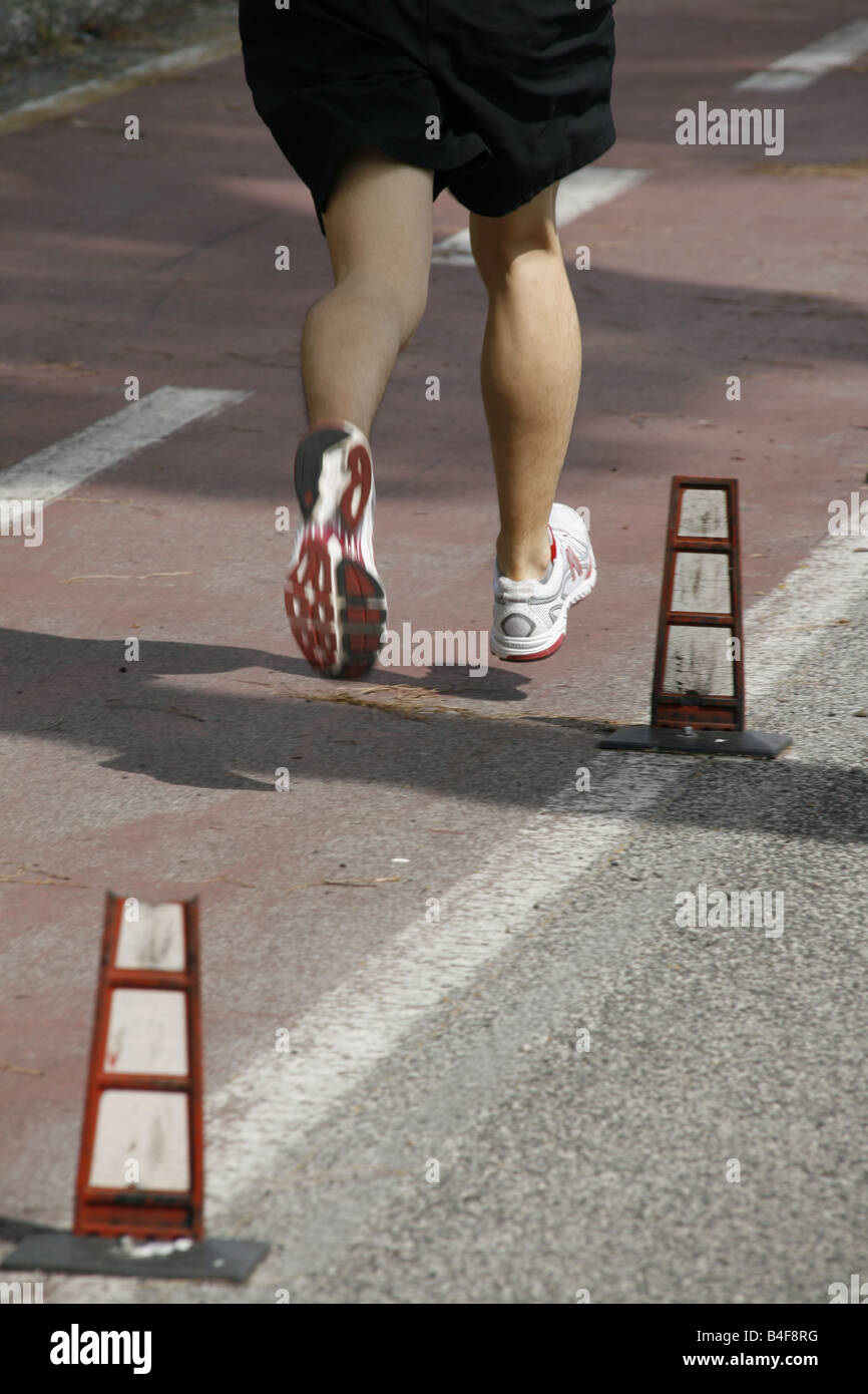 one fast runner in action on cycle path street in countryside Stock ...