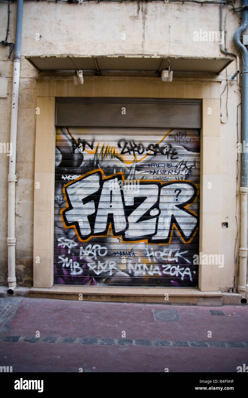 French graffiti on shop shutters Stock Photo - Alamy