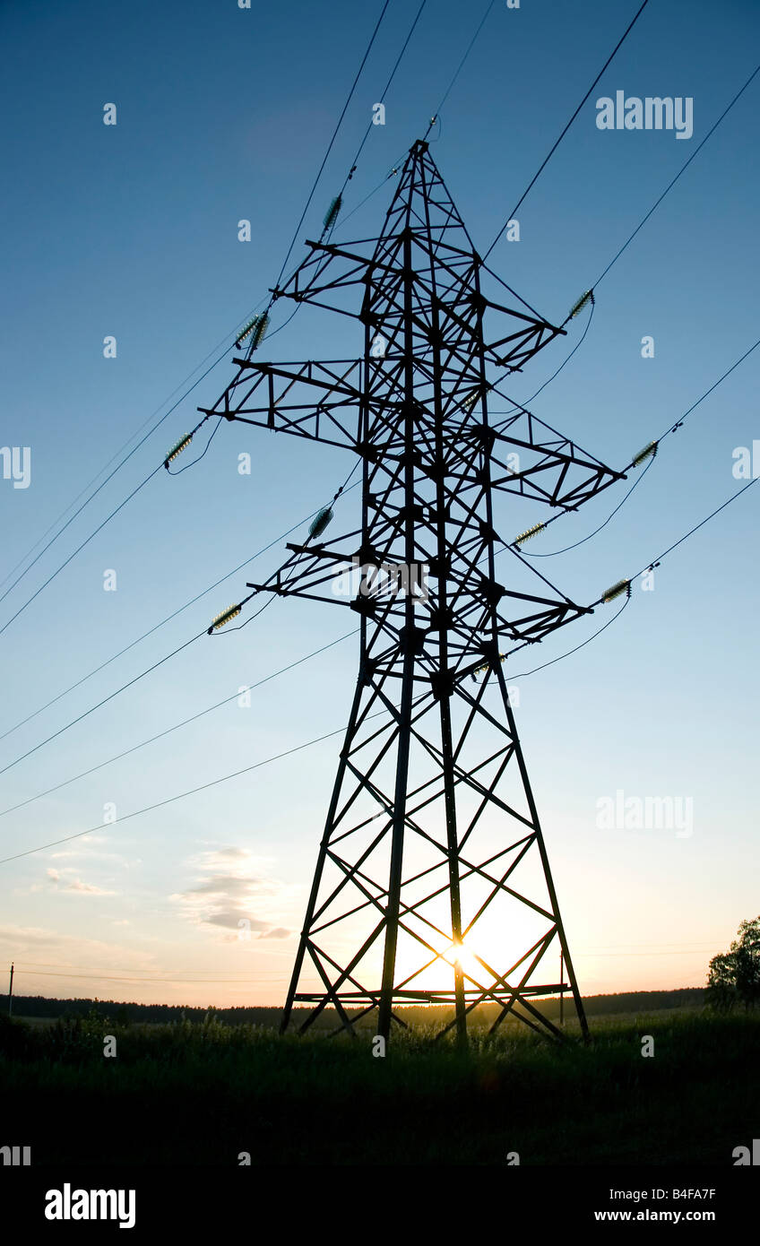 A large electric post is in the rays of a sunset Stock Photo - Alamy