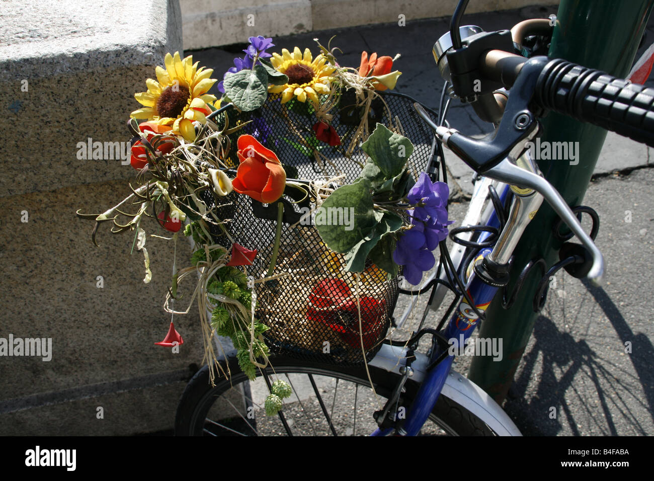 bike decorated with flowers in street in city town Stock Photo - Alamy