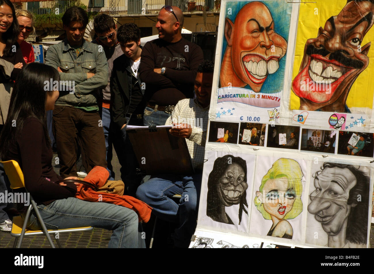 Street artist drawing caricature hi-res stock photography and images ...