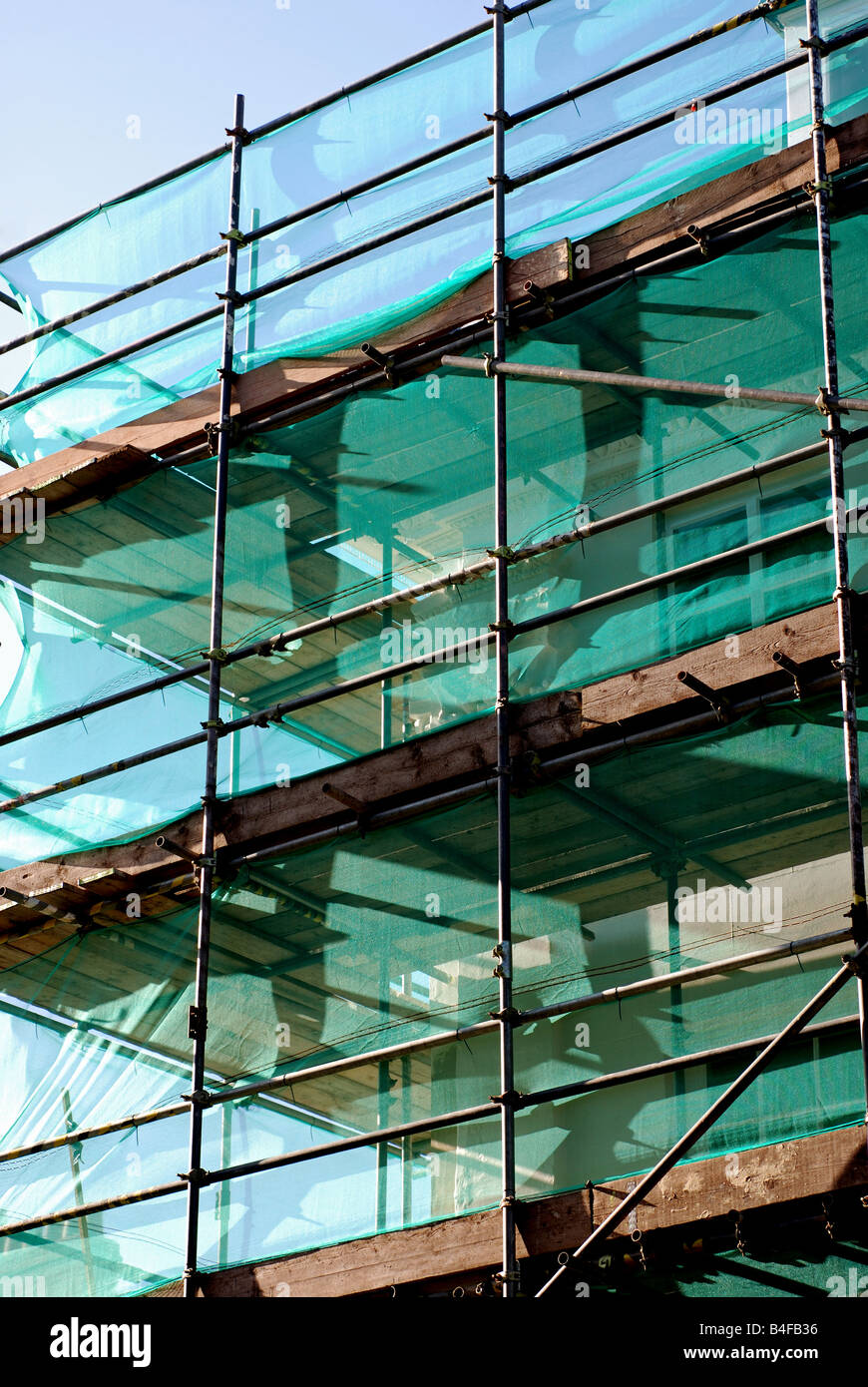 Scaffolding with green mesh on building Warwick Warwickshire England UK ...