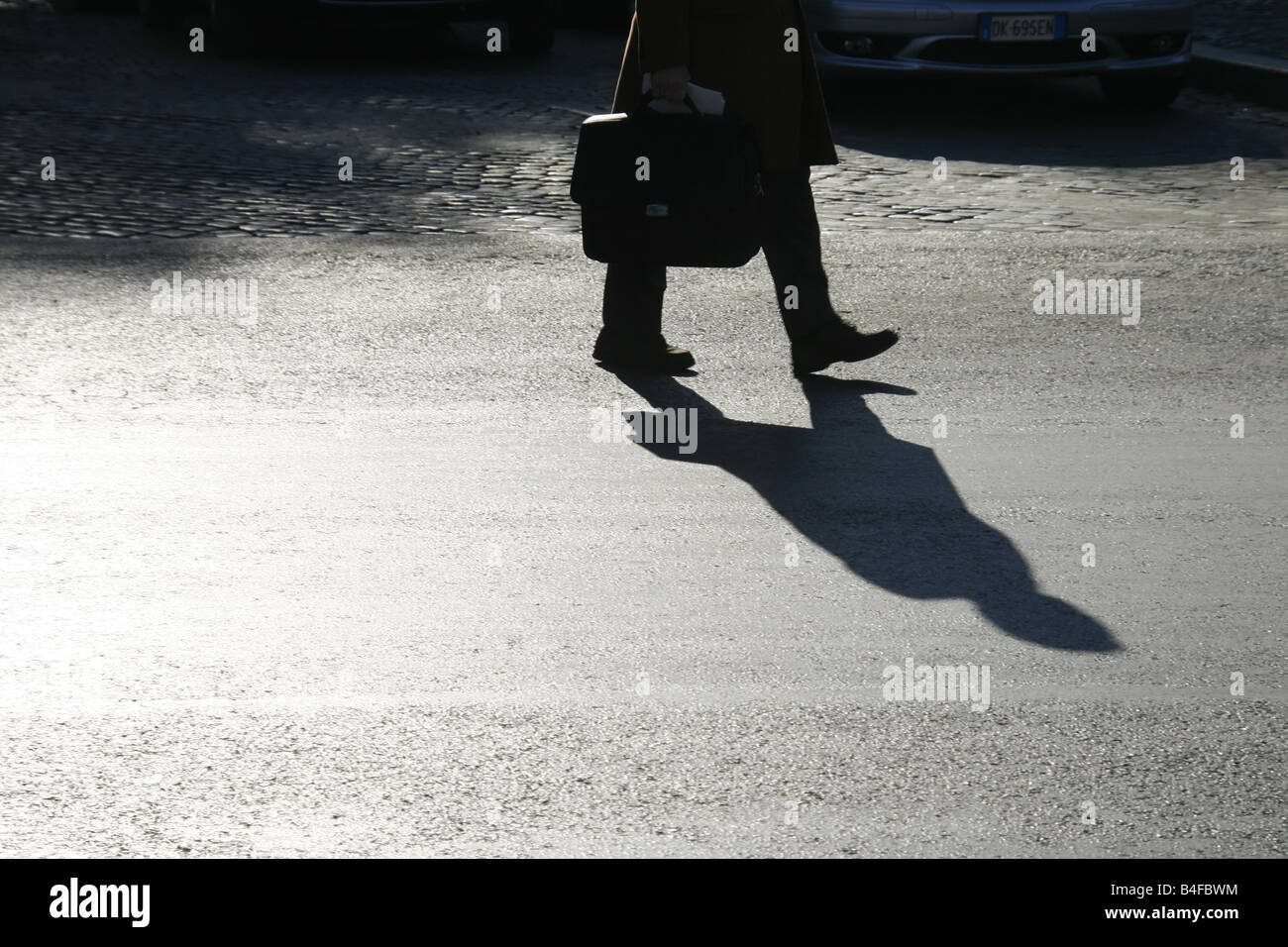 one person walking in street in city town Stock Photo - Alamy