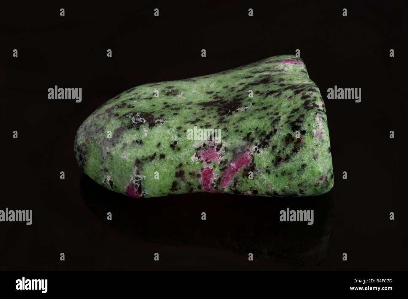 Ruby Zoisite or Anyolite gem specimen on black background Stock Photo ...
