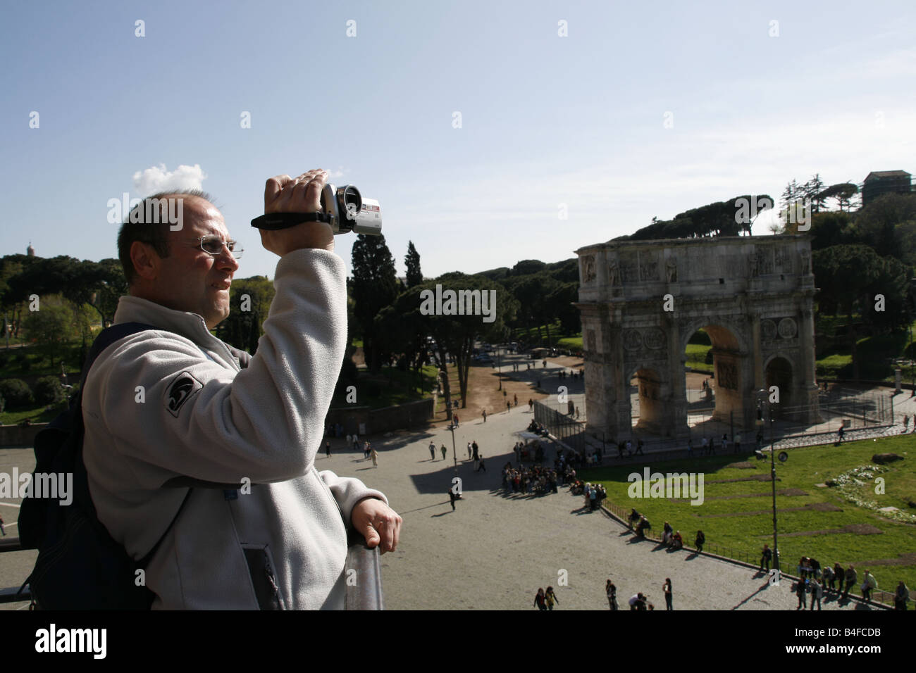 man using video camera in the colosseum in rome italy Stock Photo - Alamy