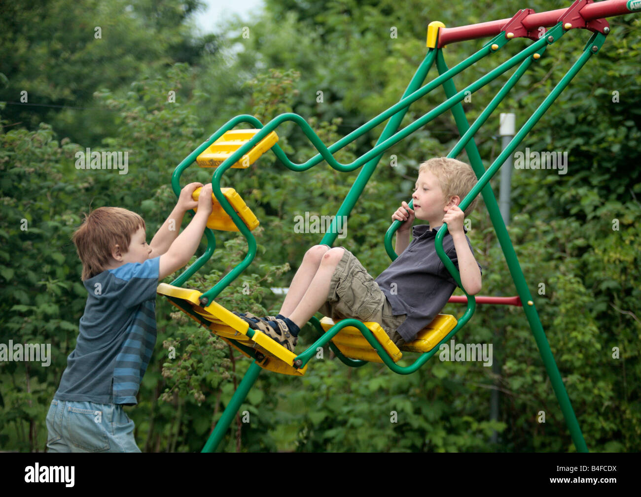 Pushed child on swing hi-res stock photography and images - Alamy