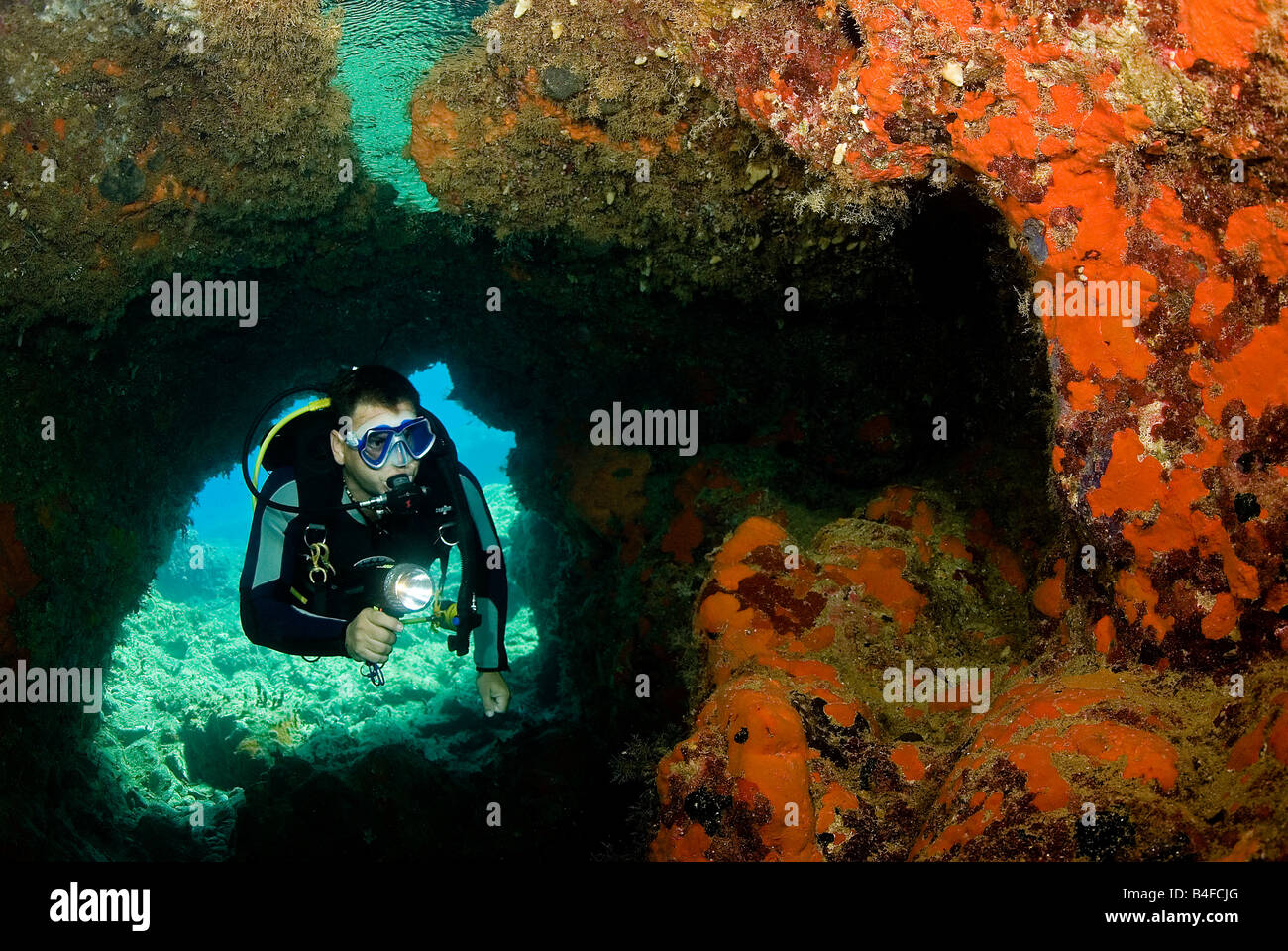 diver deep inside a colourful cave Stock Photo - Alamy