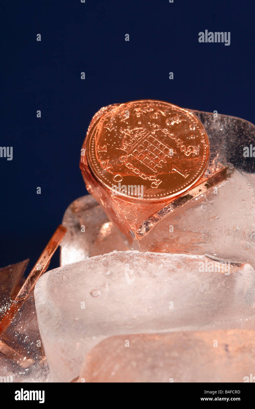 Frozen assets coin money cash in ice block financial freeze concept ...