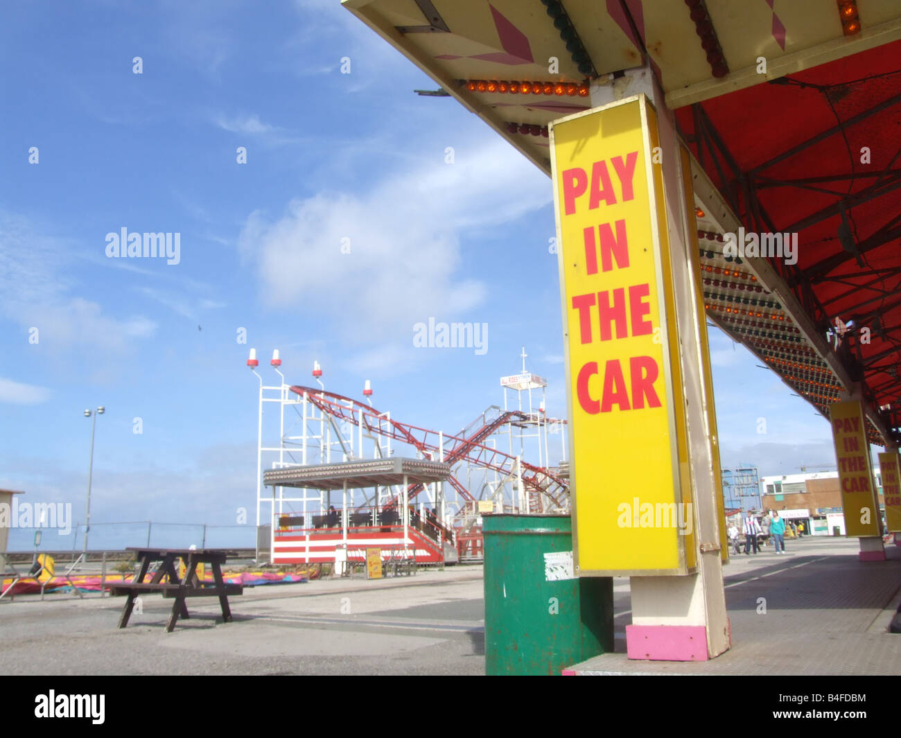 pay in the car sign in empty fairground in sun Stock Photo - Alamy
