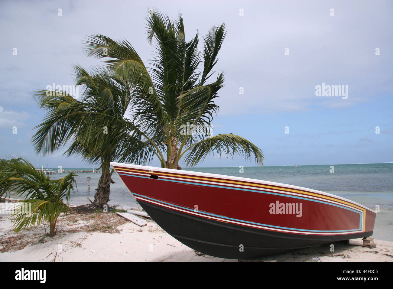 Boat on the beach in Caye Caulker, Belize Stock Photo - Alamy