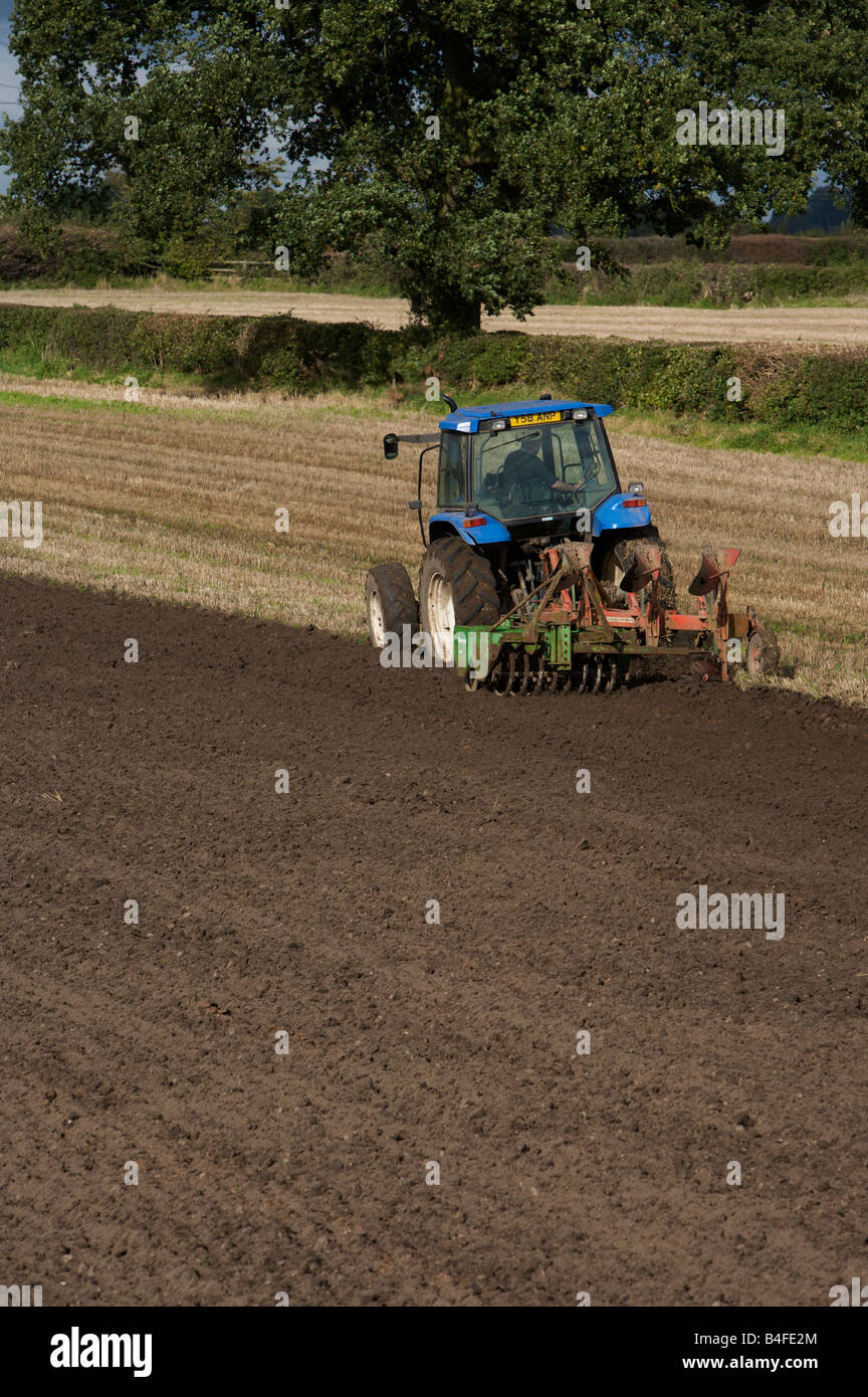 Ploughing up a stubble field ready to plant Barley with a New Holland ...
