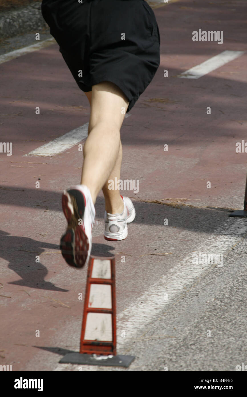 one fast runner in action on cycle path street in countryside Stock ...