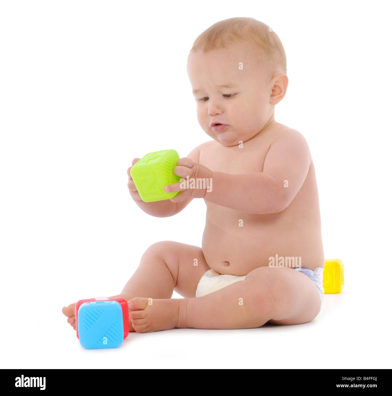 A young baby learning to walk and crawl, babies development in the ...