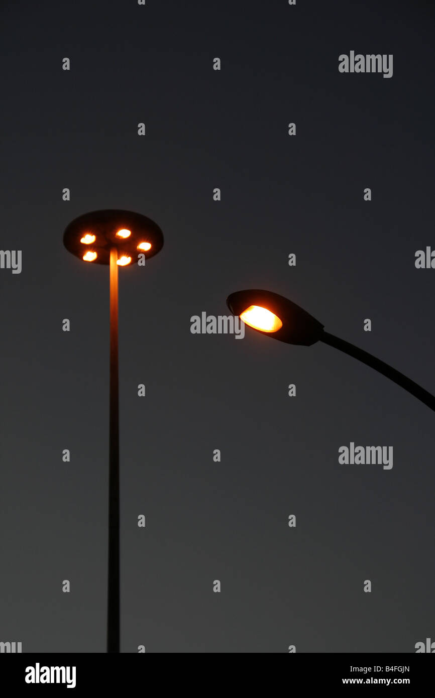 modern lamp posts in city street at night Stock Photo - Alamy