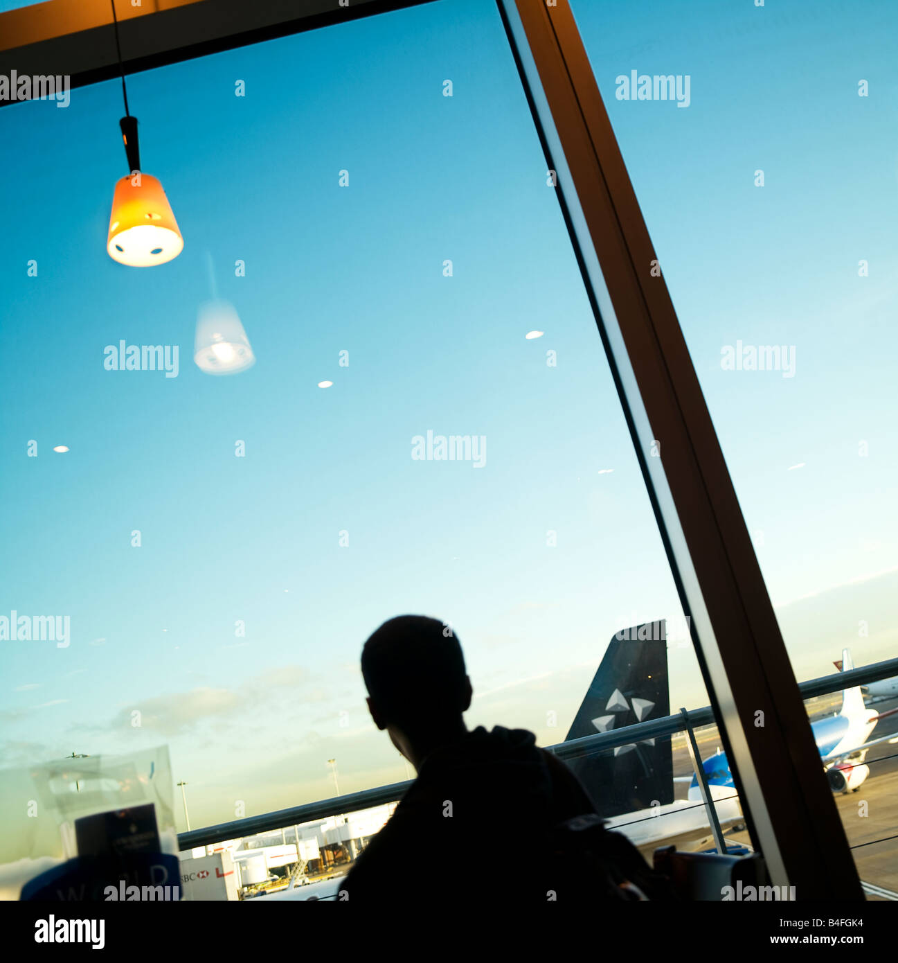 View out window onto parked aeroplane at Heathrow Airport London ...