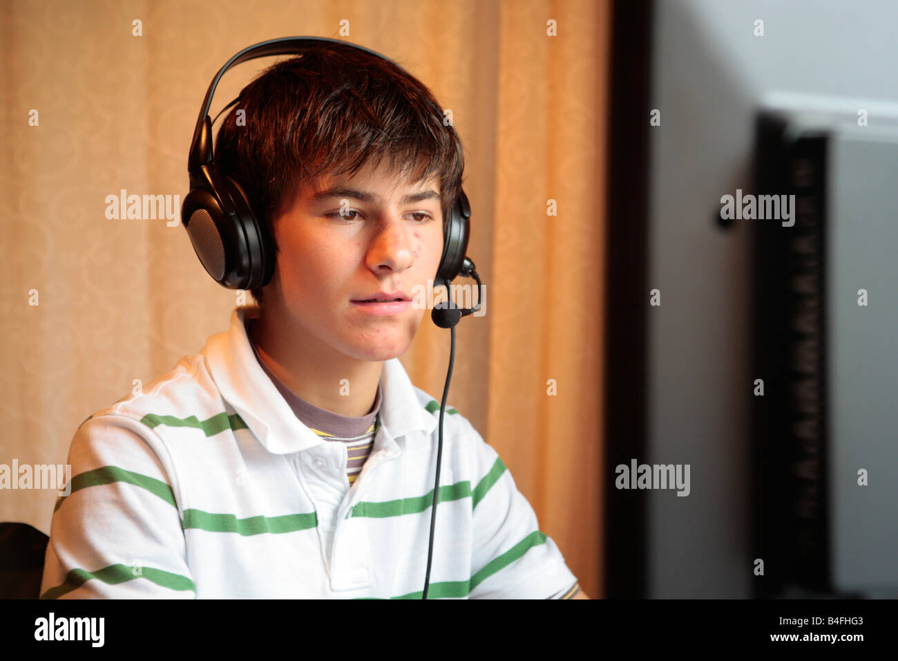 Portait of a teenage boy in front of his computer Stock Photo - Alamy