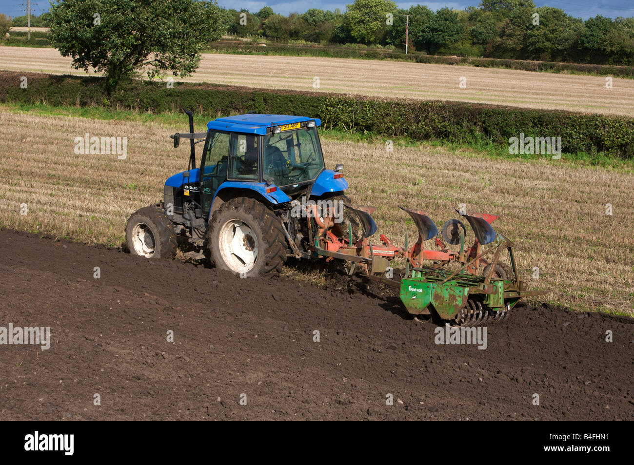 Ploughing up a stubble field ready to plant Barley with a New Holland ...