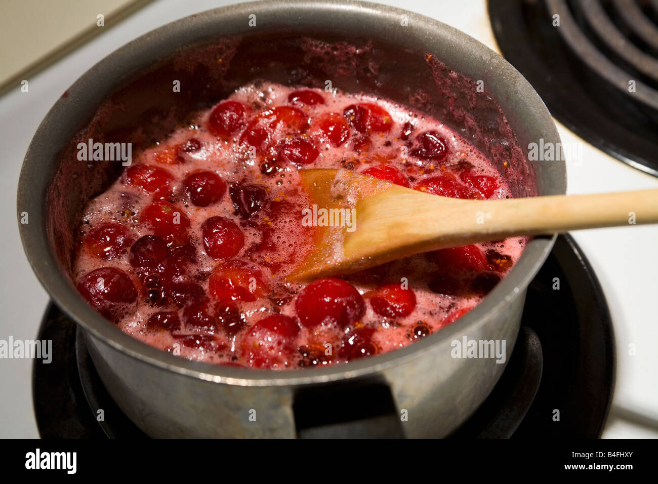 Cranberry sauce made from fresh cranberries cooking on the stove Stock ...