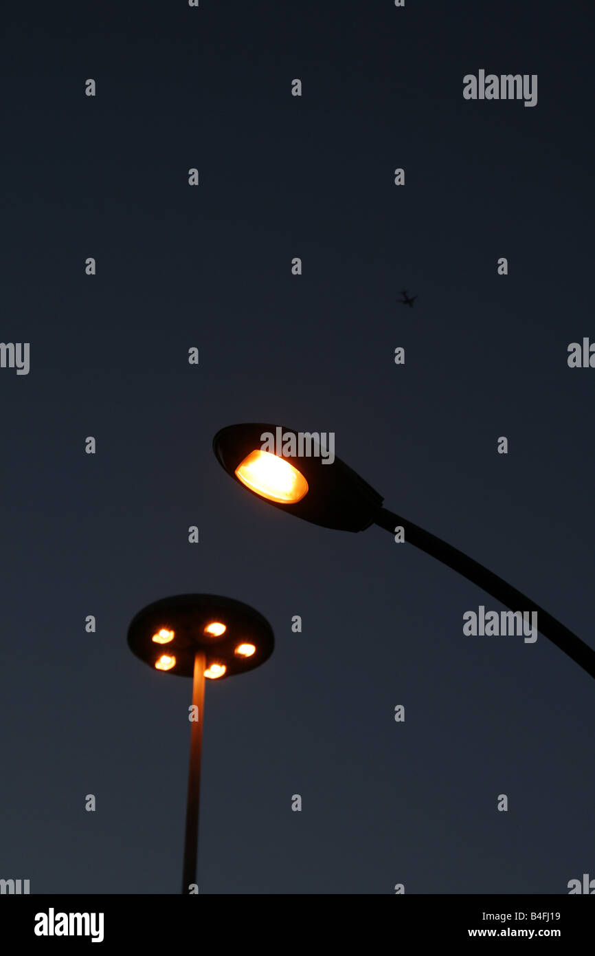 modern lamp posts in city street at night Stock Photo - Alamy