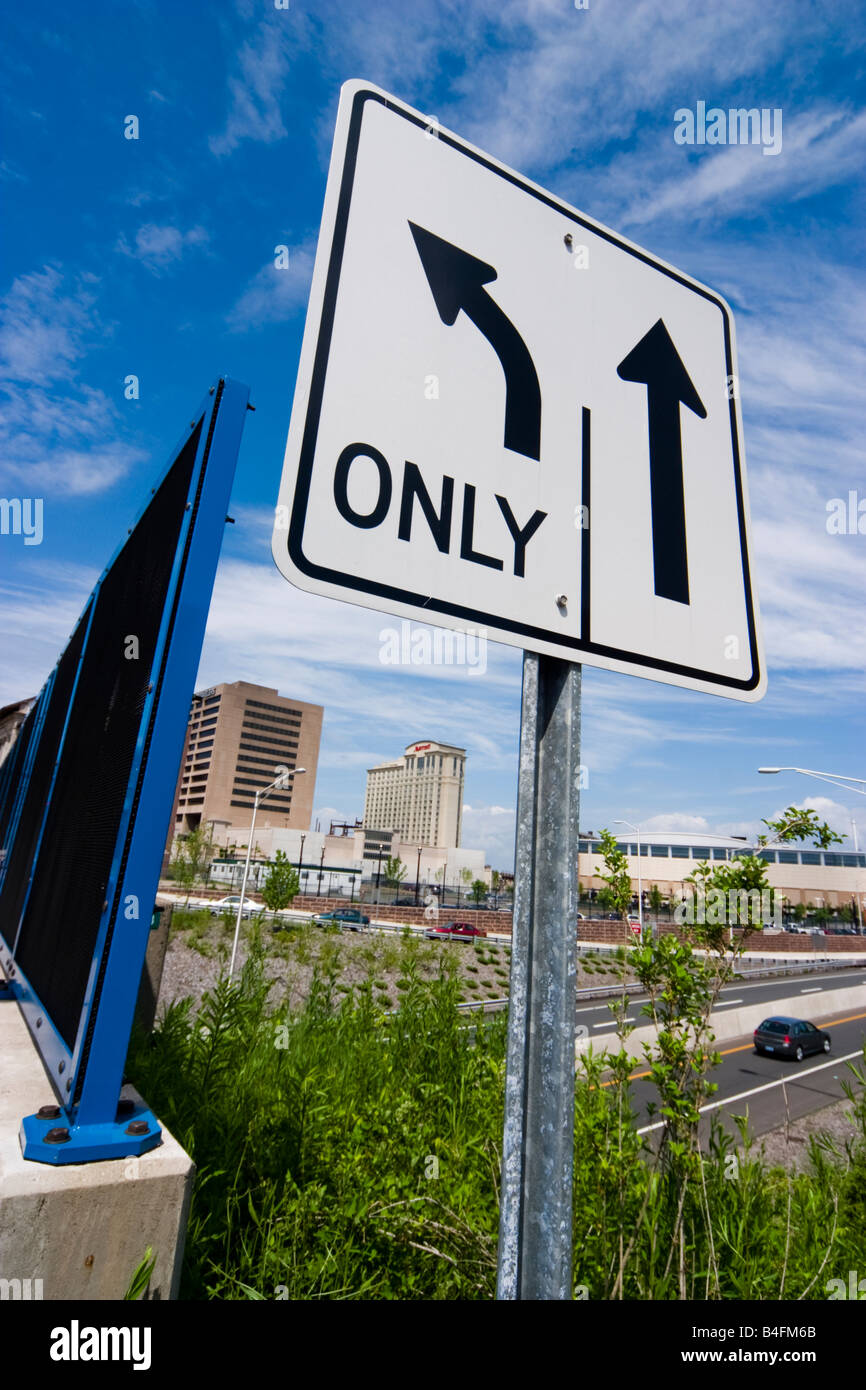 Traffic sign with directional arrows printed on it Stock Photo - Alamy