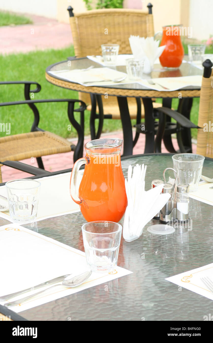 Restaurant table with jug of juice Stock Photo - Alamy