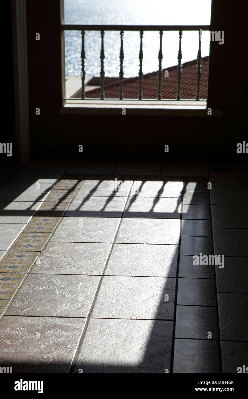 Shadow in corridor with view of sea Stock Photo - Alamy