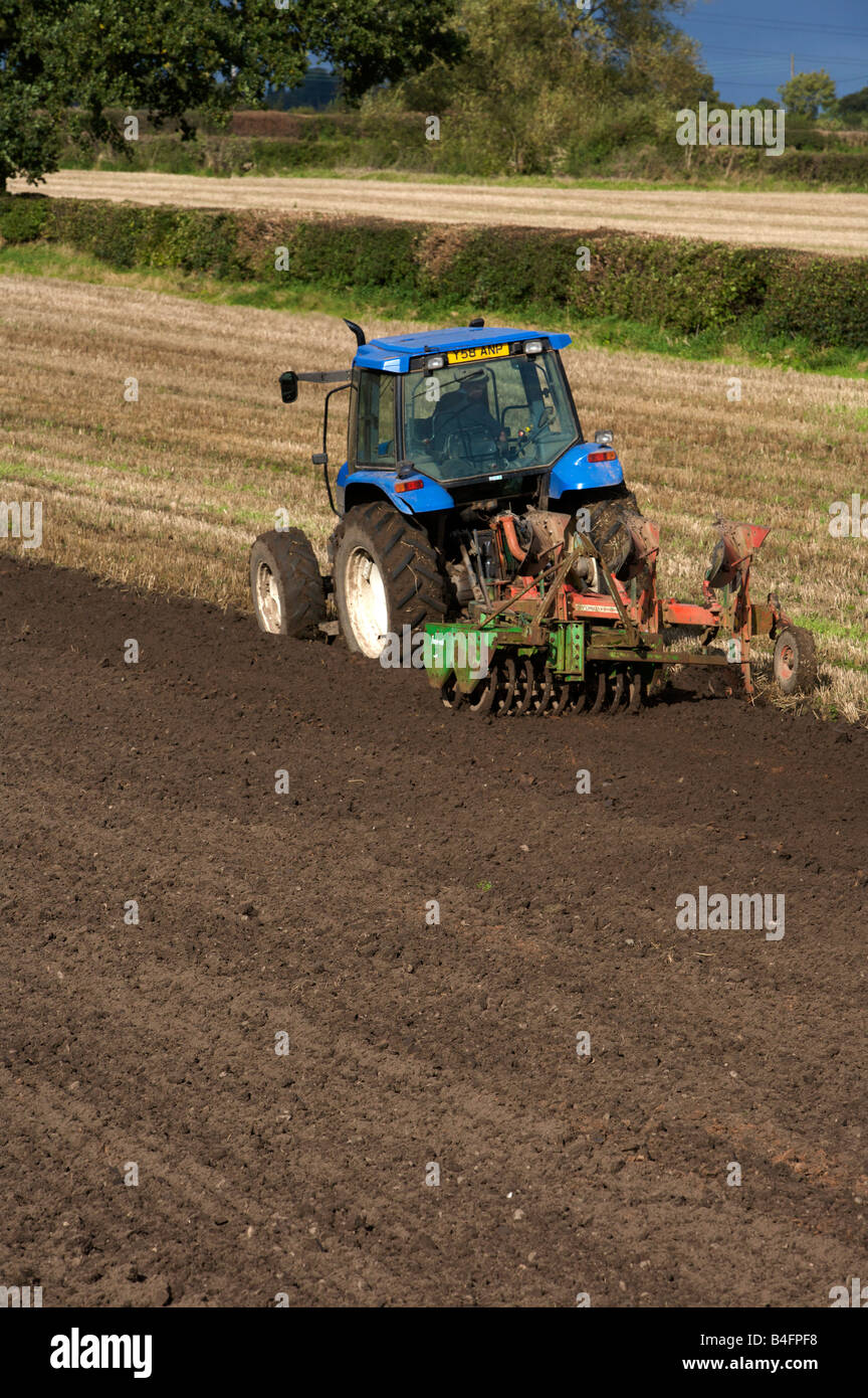Ploughing up a stubble field ready to plant Barley with a New Holland ...