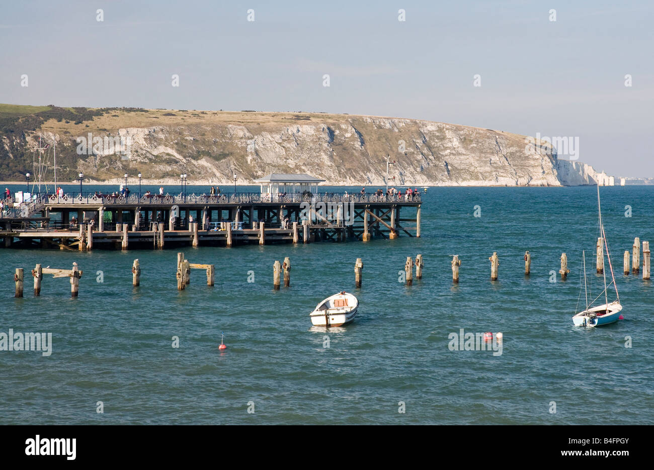 Swanage bay pier and Ballard Point with Old Harry rocks in the distance ...