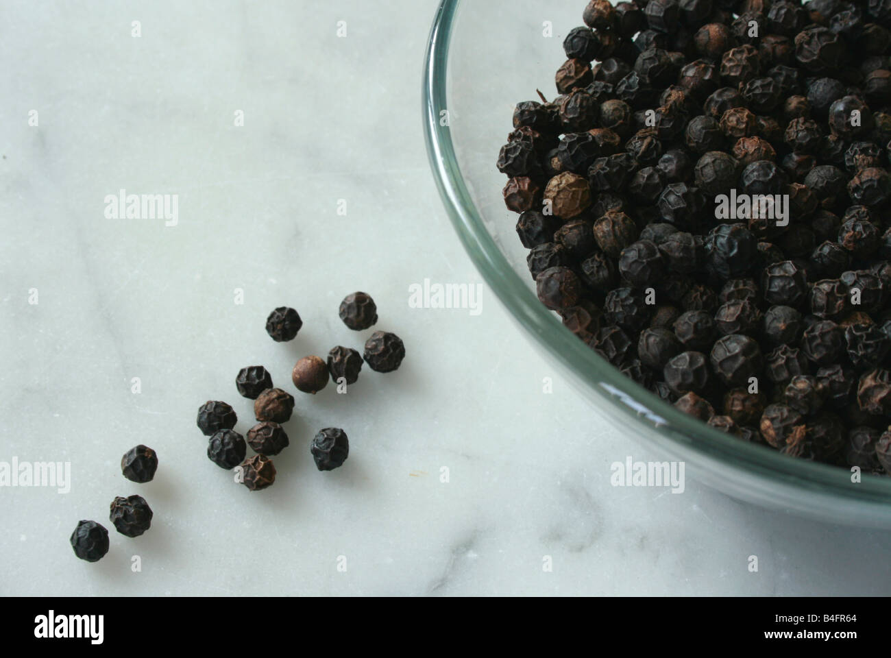 Whole black peppercorns Stock Photo - Alamy