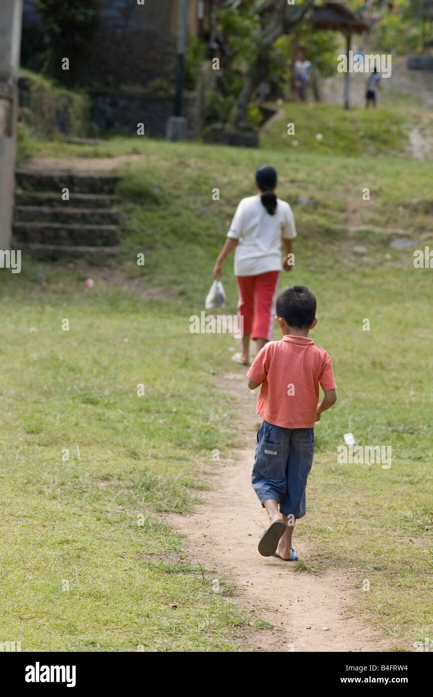 Son following Mother Stock Photo - Alamy