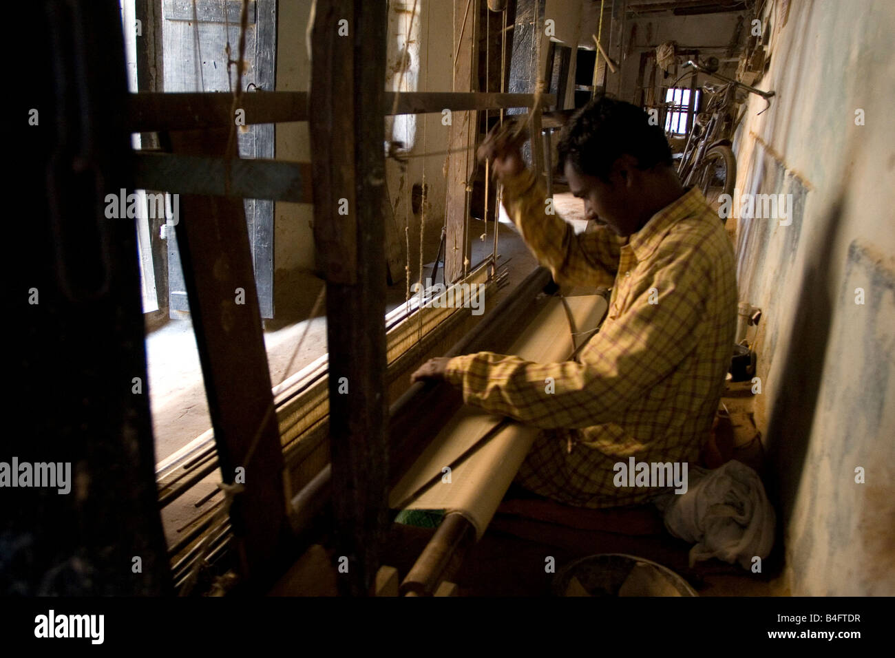 A man weaving at one of the cooperatives in an area that is famous for ...