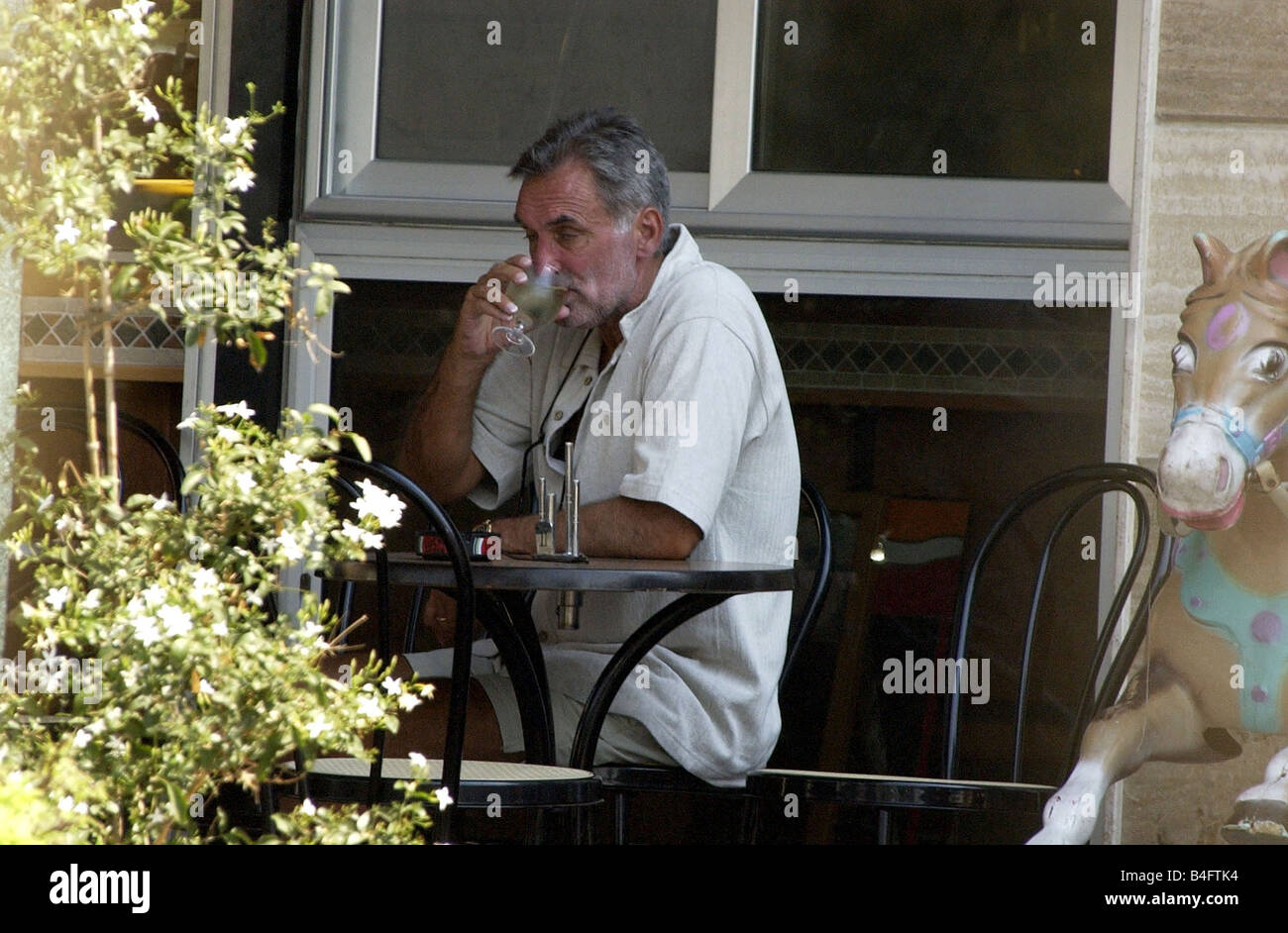 George Best drinks white wine at Georgios wine bar Sliema Malta This ...