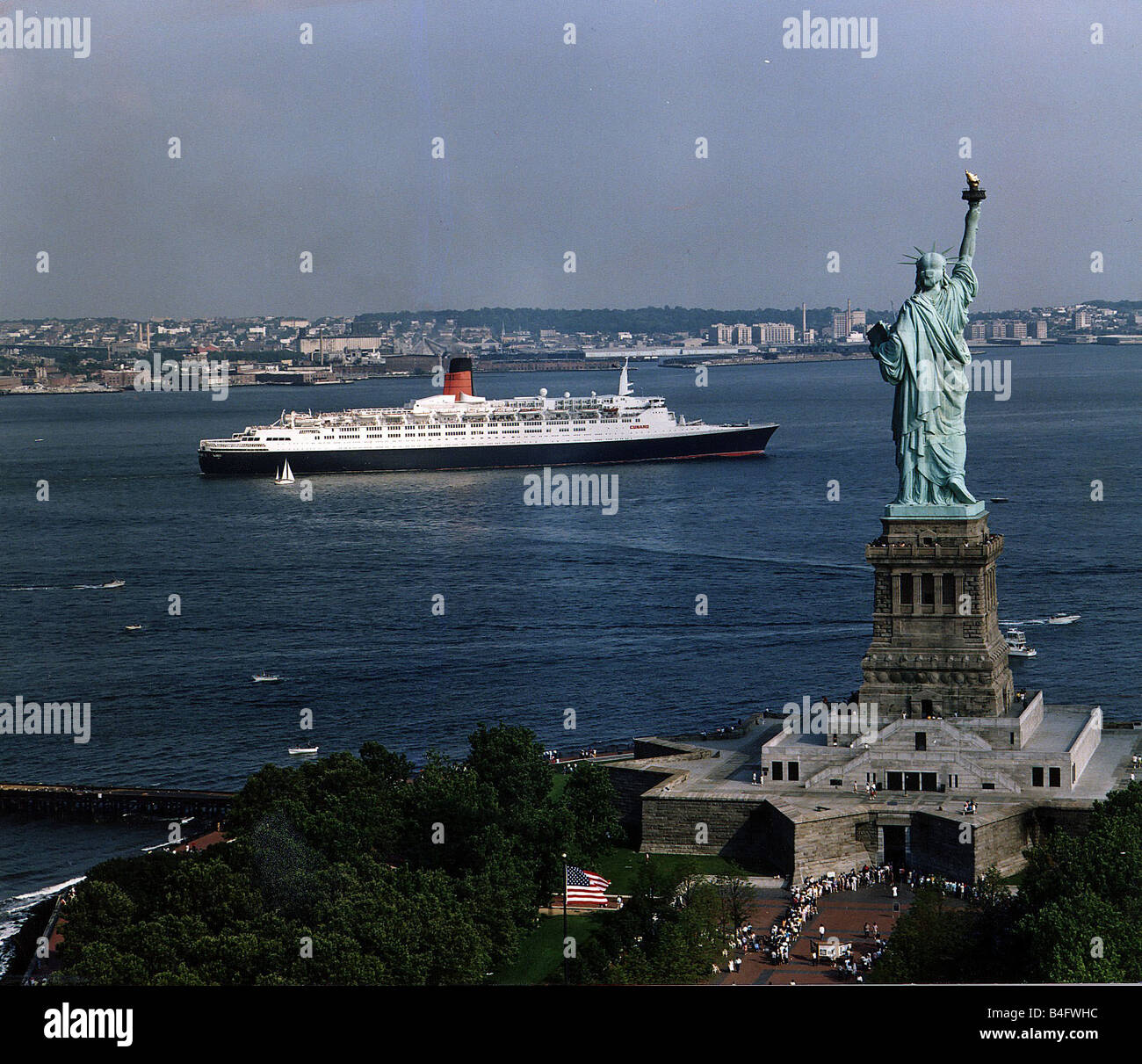The QE2 Ship leaves New York Harbour past the Statue of Liberty April ...