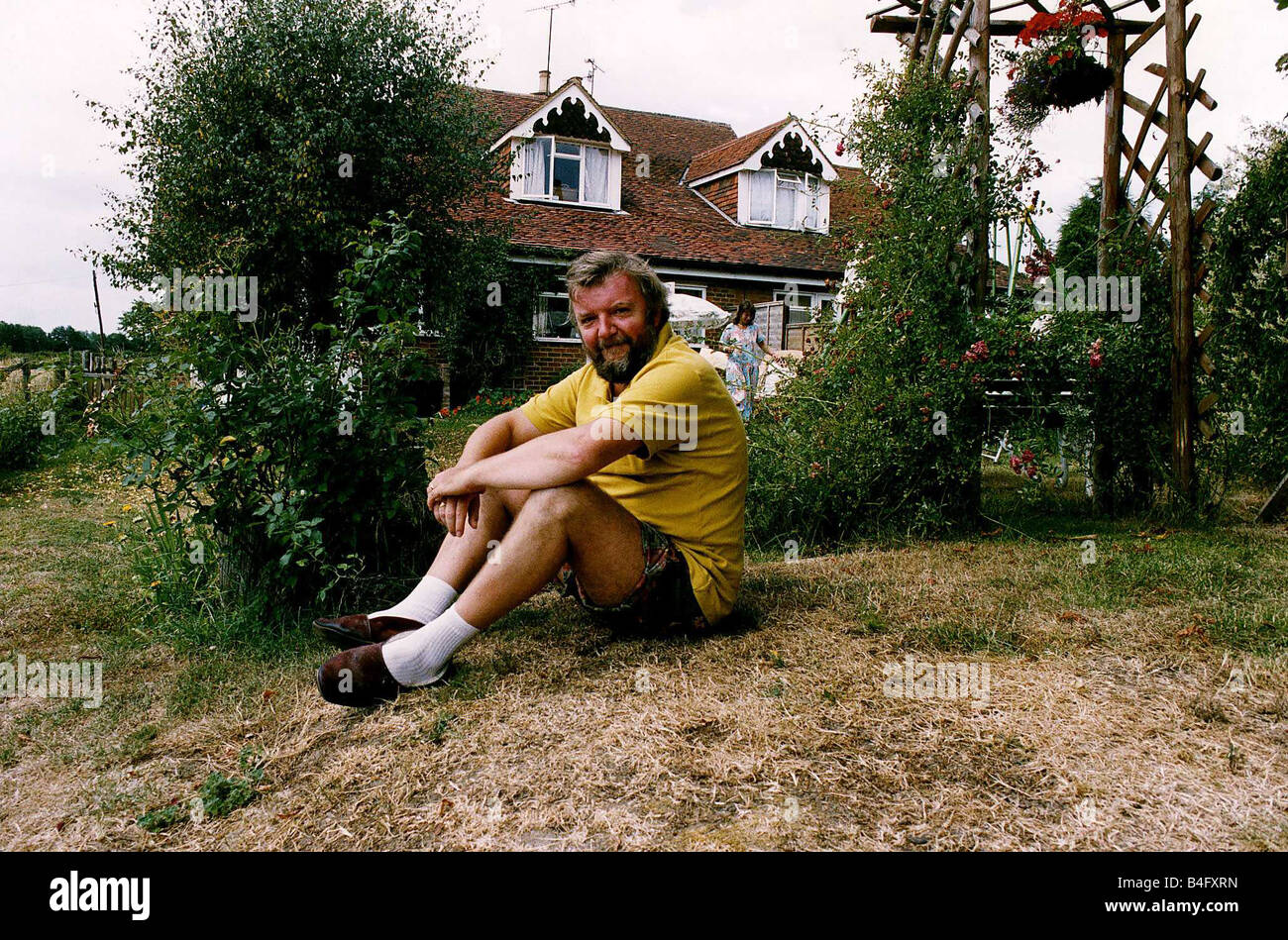 Tony Haygarth Actor sitting on gress in his garden Mirrorpix Stock ...