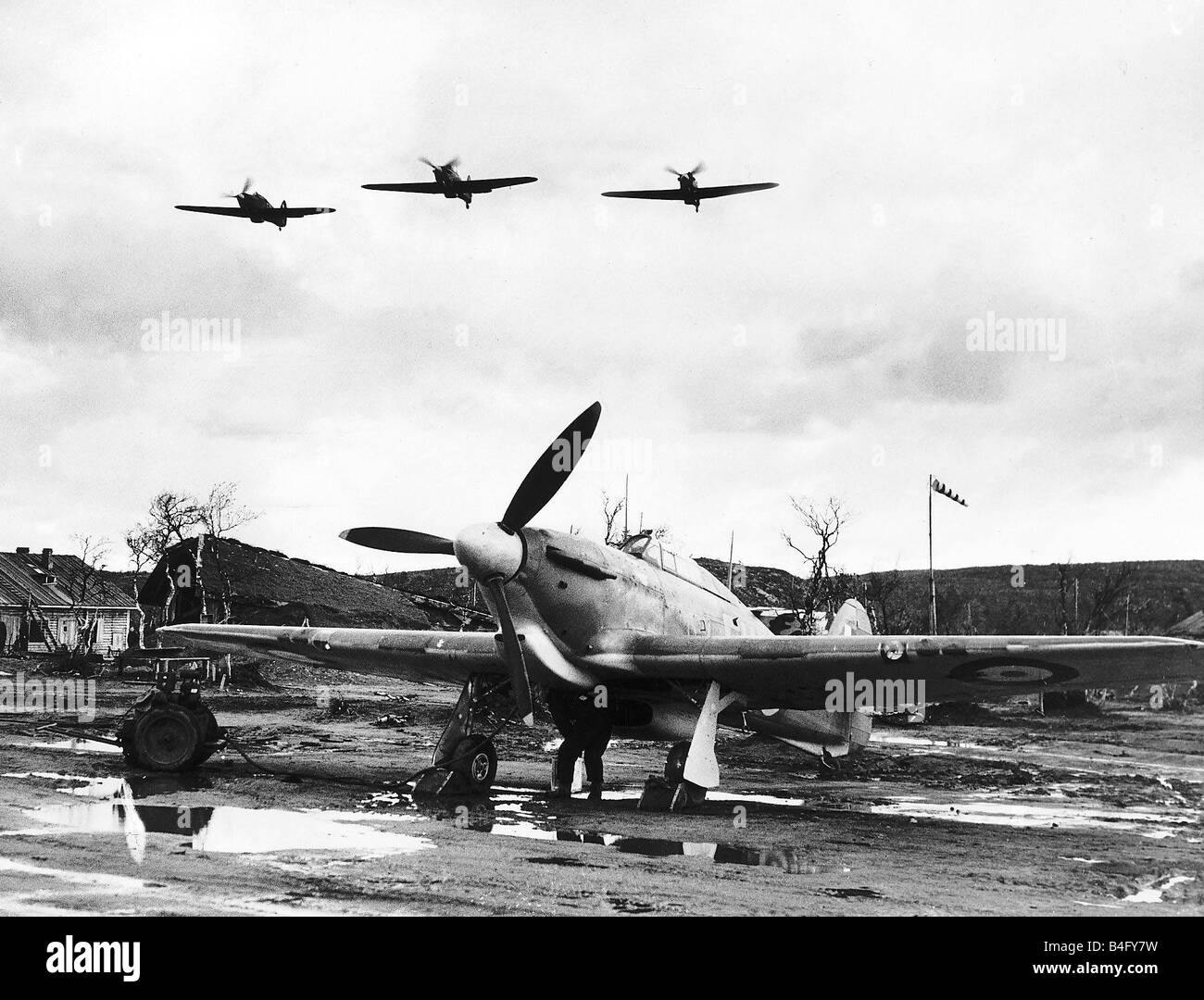 An RAF Hawker Hurricane sits on a muddy Russian airfield as Hurricanes ...