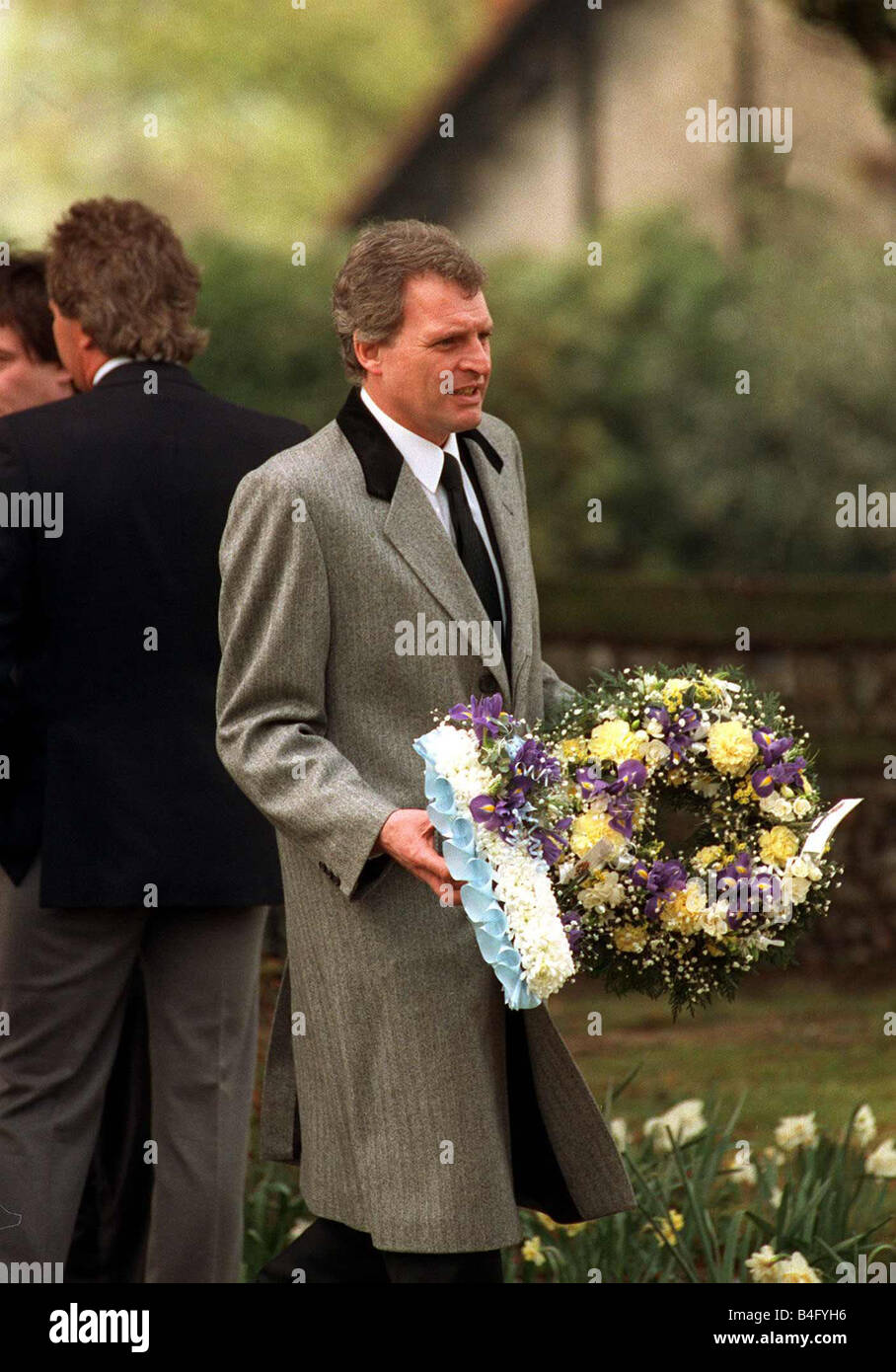 Peter Dean Actor carrying a wreath at the funeal of Mark Reid the son ...