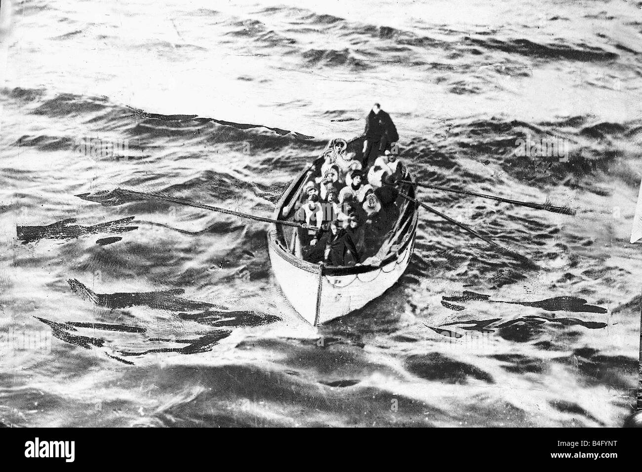 Survivors from the Titanic ship disaster in a lifeboat approaching the ...